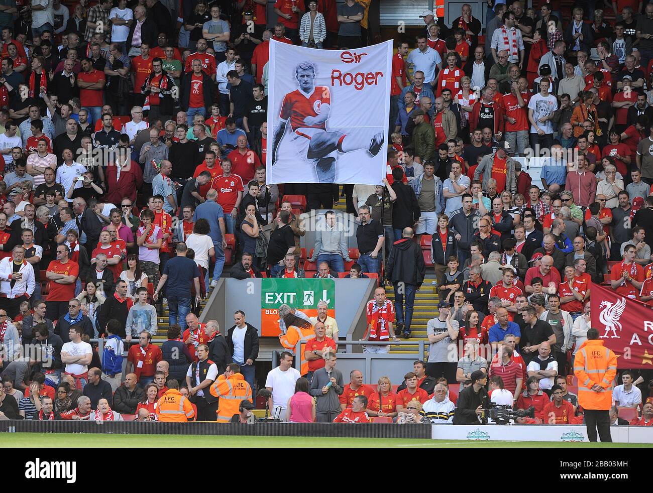 Liverpool fans in the with sir roger hunt banner hi-res stock ...