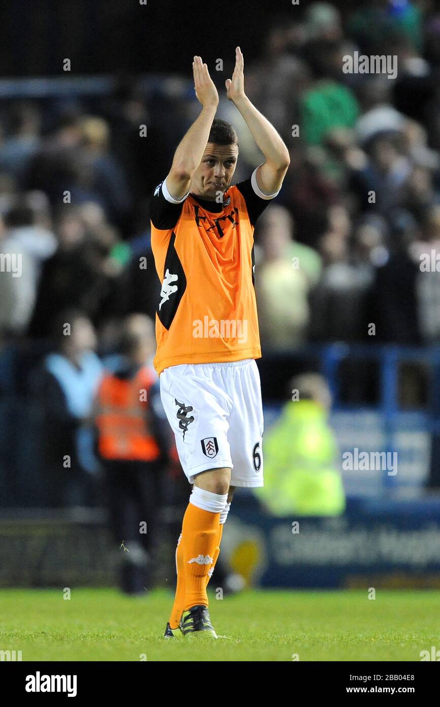 Fulham's Chris Baird acknowledges the travelling support Stock Photo ...