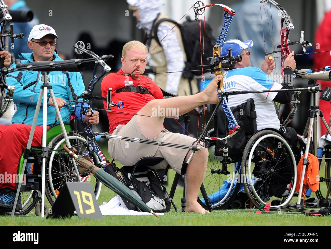 USA's Matt Stutzman holds the bow with his foot as he competes during ...