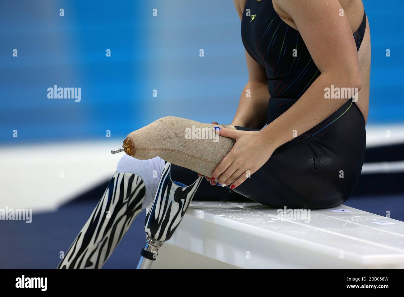 USA's Jessica Long prepares to put on her prosthetic legs after her ...