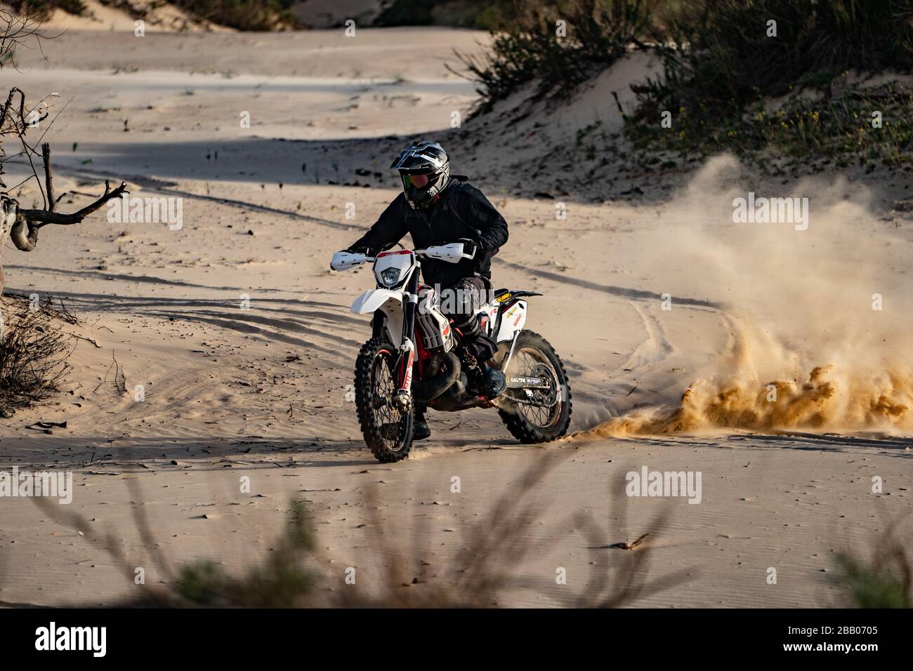 Dirt bike on a sand dune Stock Photo - Alamy