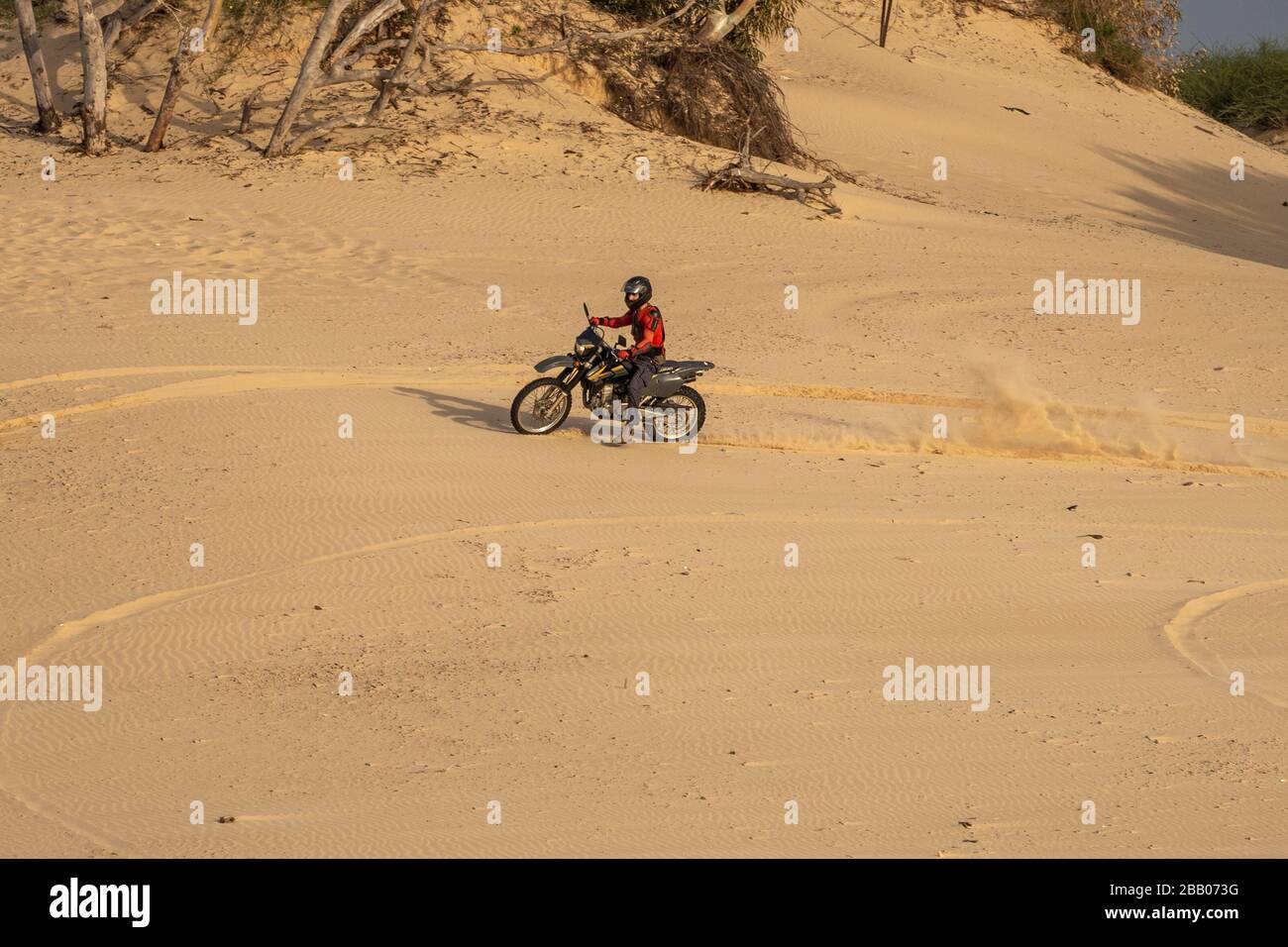 Dirt bike on a sand dune Stock Photo - Alamy
