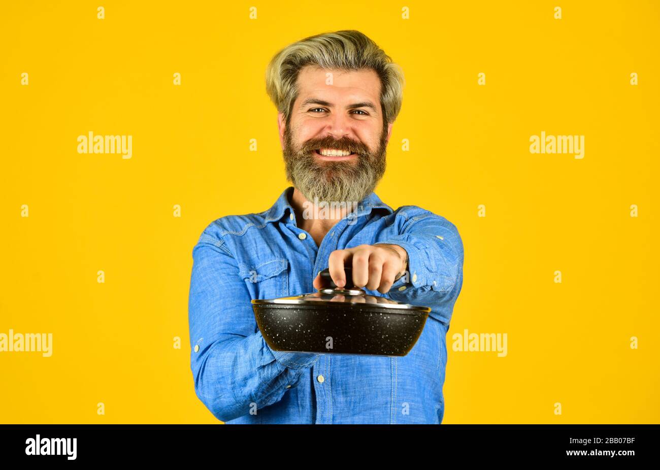 Nonstick pan porcelain surface. Man hold new pan. Cooking healthy food ...