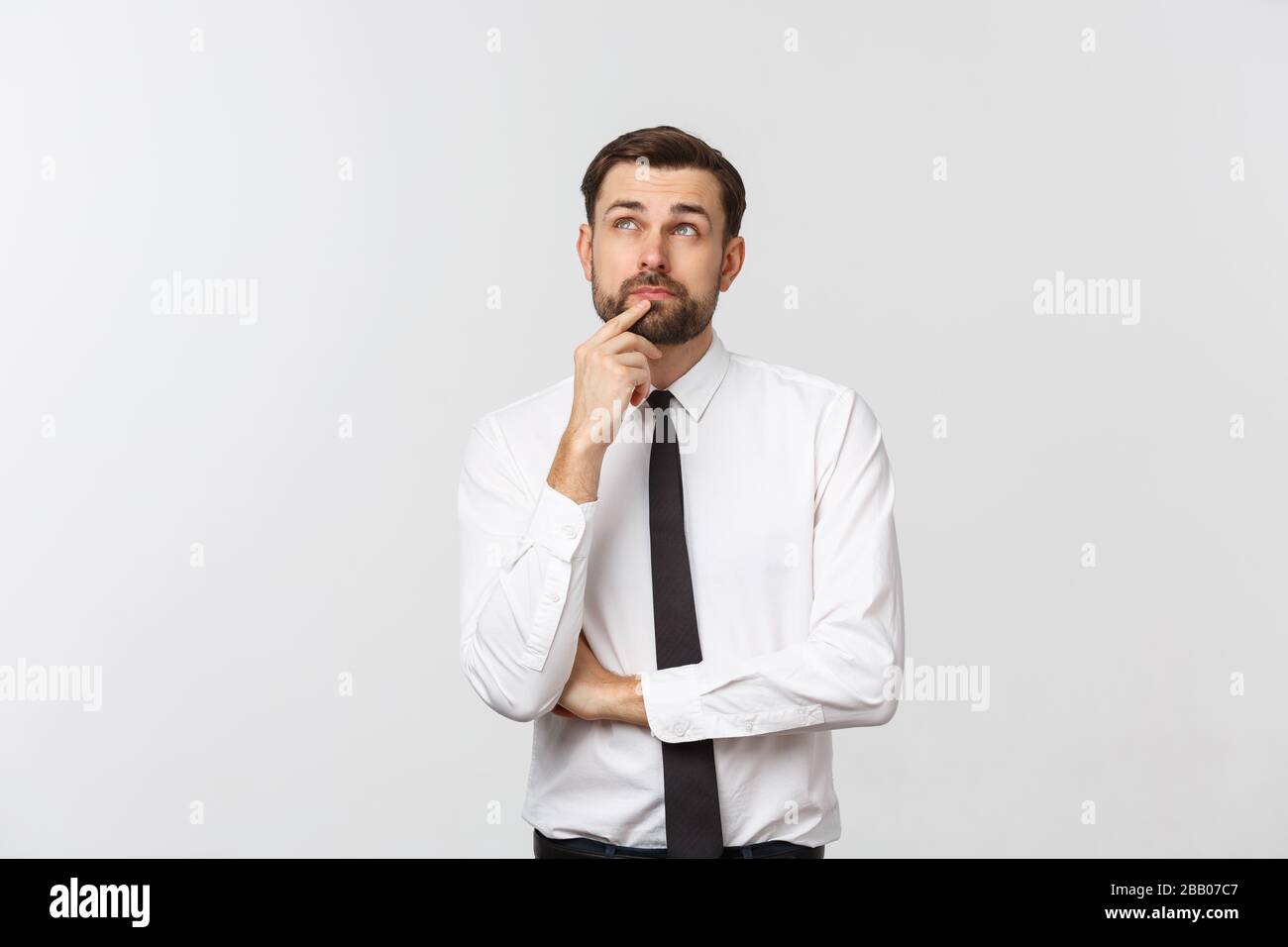 Thinking man isolated on white background. Closeup portrait of a casual ...