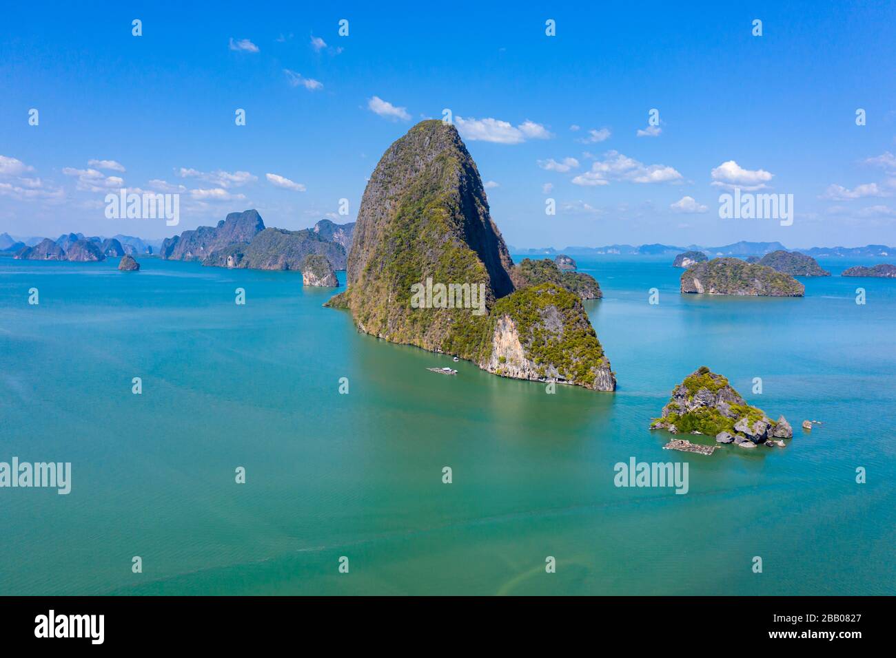 Aerial view of towering limestone islands in a beautiful tropical bay ...