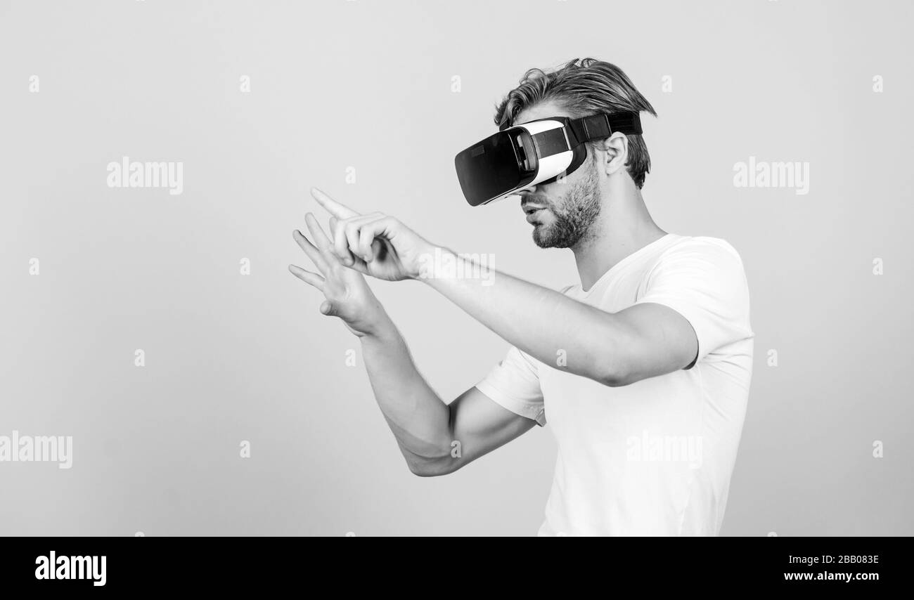 Virtual simulation. Man play game in VR glasses. Explore cyber space ...