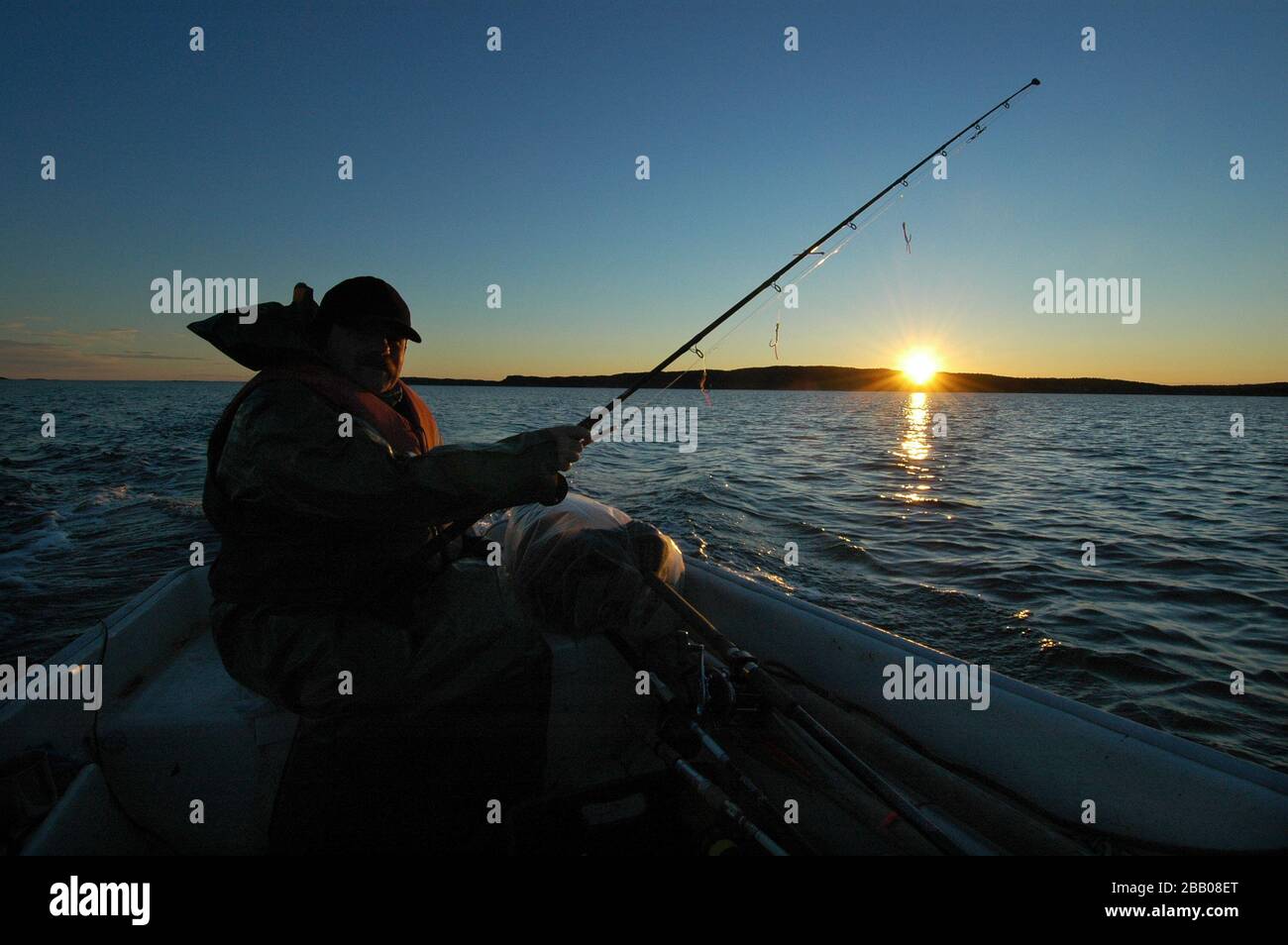 Fisherman fishing in the sea Stock Photo - Alamy