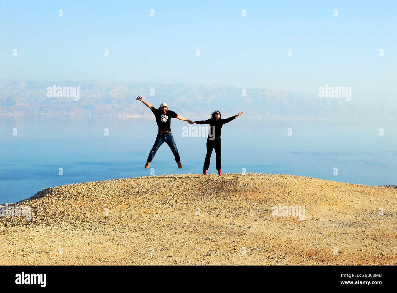 Man jumping on edge cliff hi-res stock photography and images - Alamy