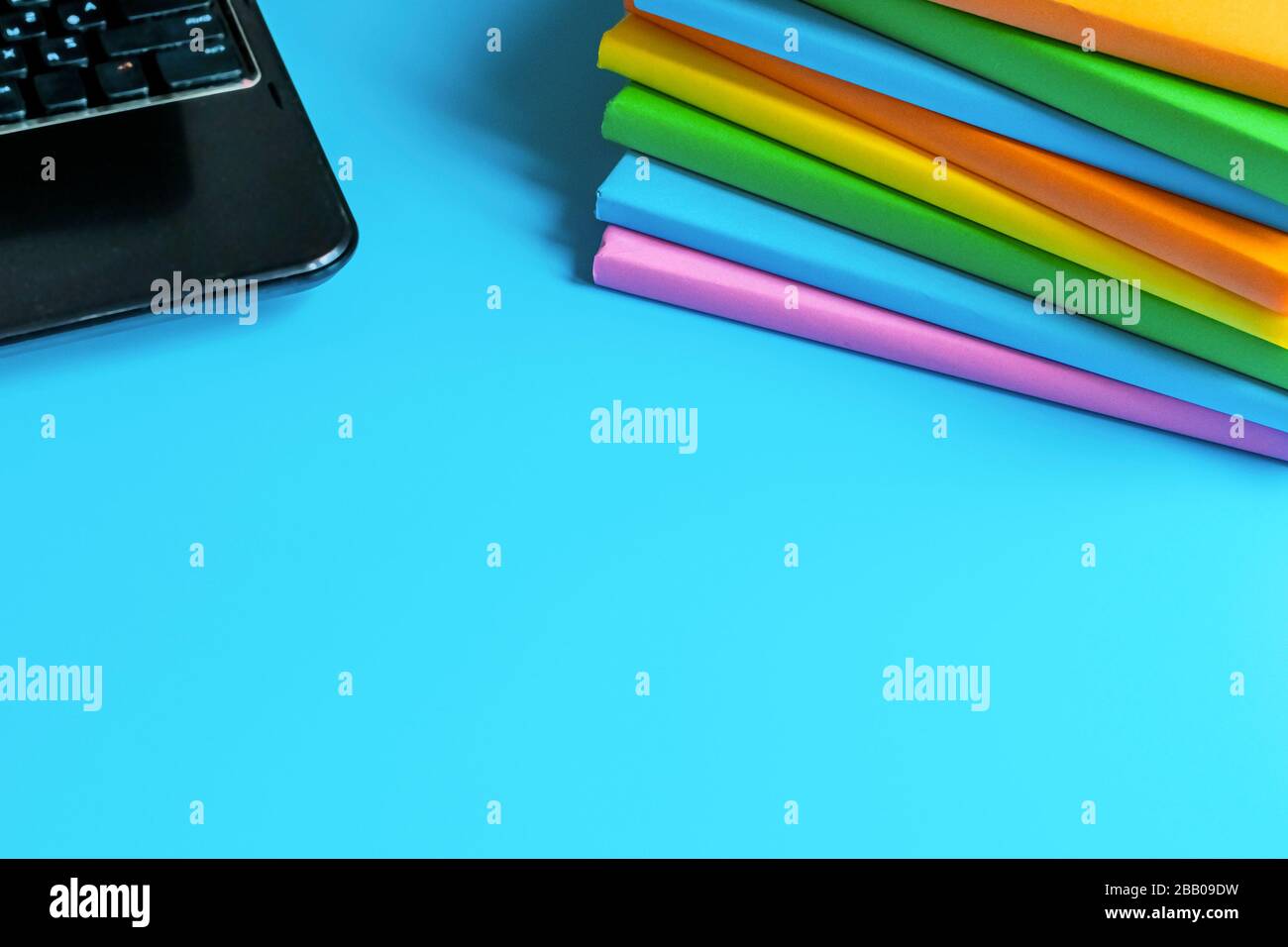 Distance Learning Concept. Stack of books, laptop. Online training ...