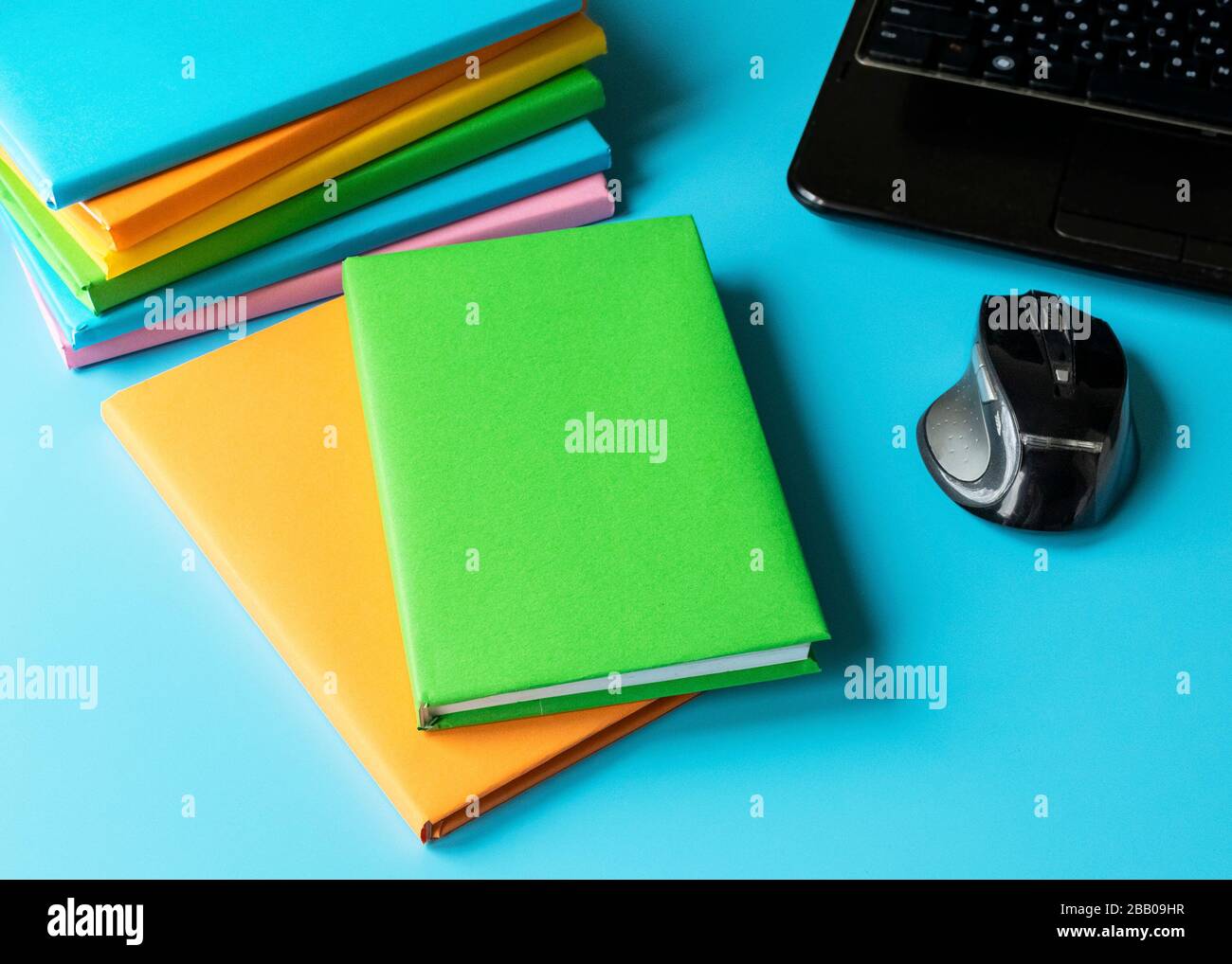 Distance Learning Concept. Stack of books, laptop. Online training ...