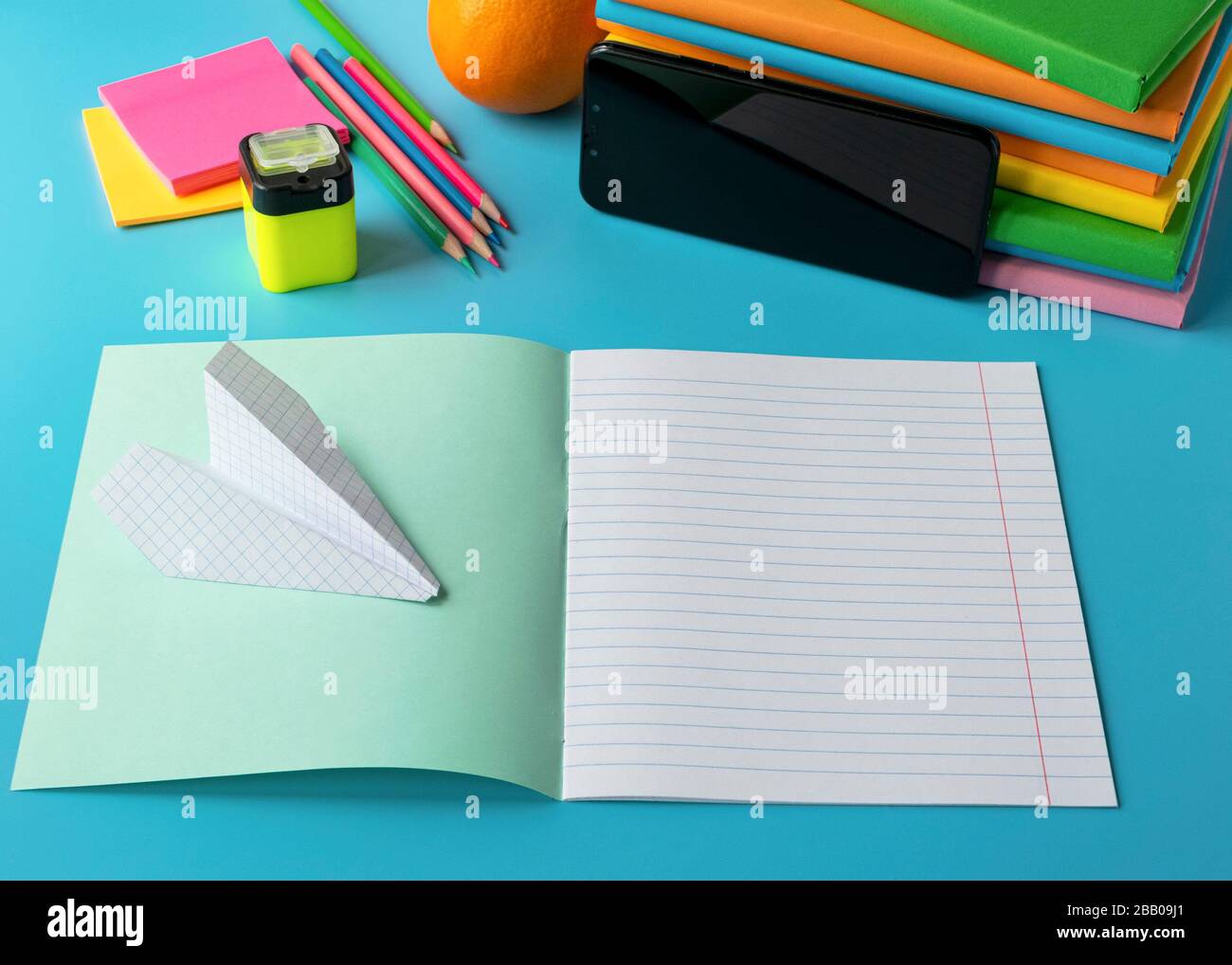 Distance Learning Concept. Pile of books, notebook, pencil, mobile ...