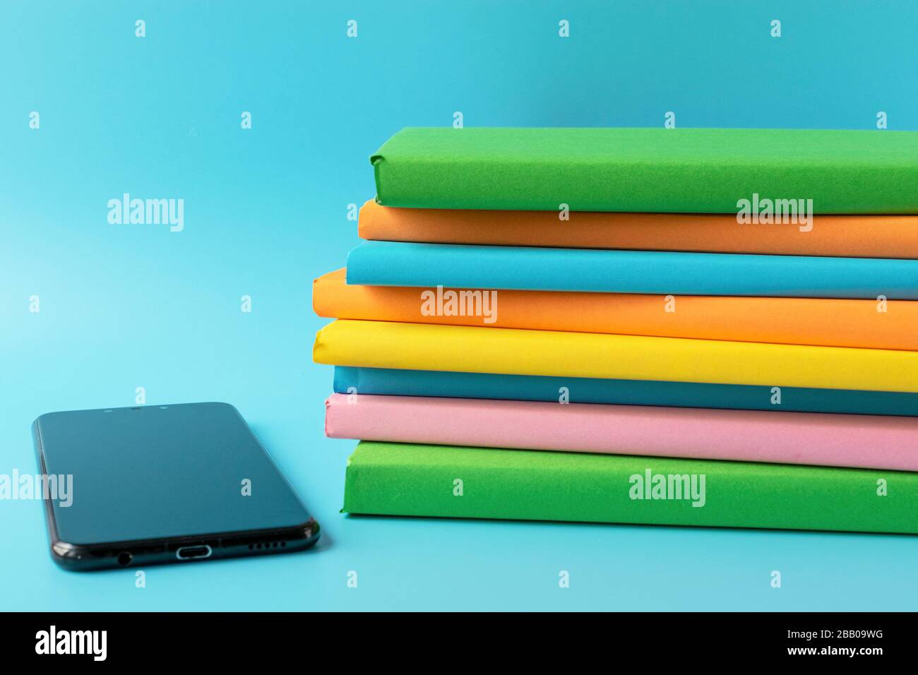 A stack of books, textbooks. Distance learning. Schoolboy is doing ...