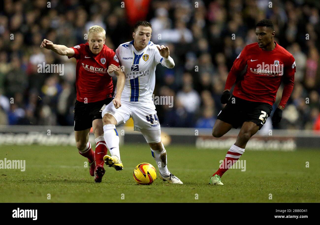 Leeds United's Ross McCormack (centre) battles for the ball with ...