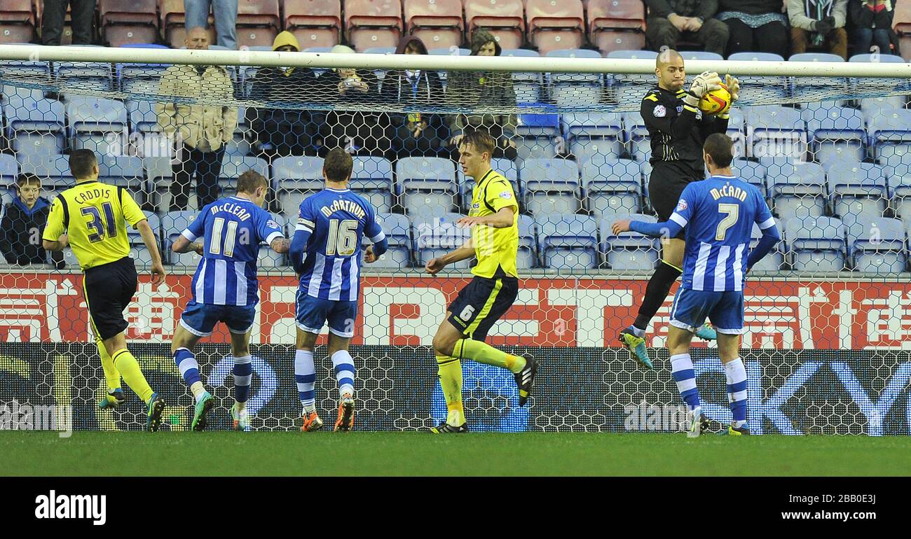 Birmingham City's Darren Randolph (right) makes a save from Wigan ...