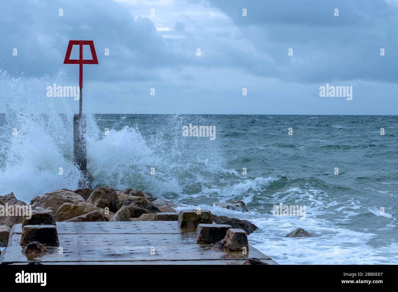 Windy groyne marker post at Bournemouth, Dorset, UK Stock Photo - Alamy