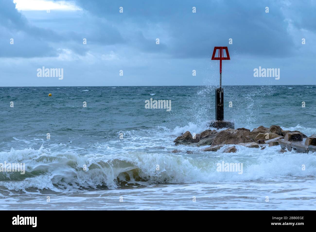 Windy groyne marker post at Bournemouth, Dorset, UK Stock Photo - Alamy