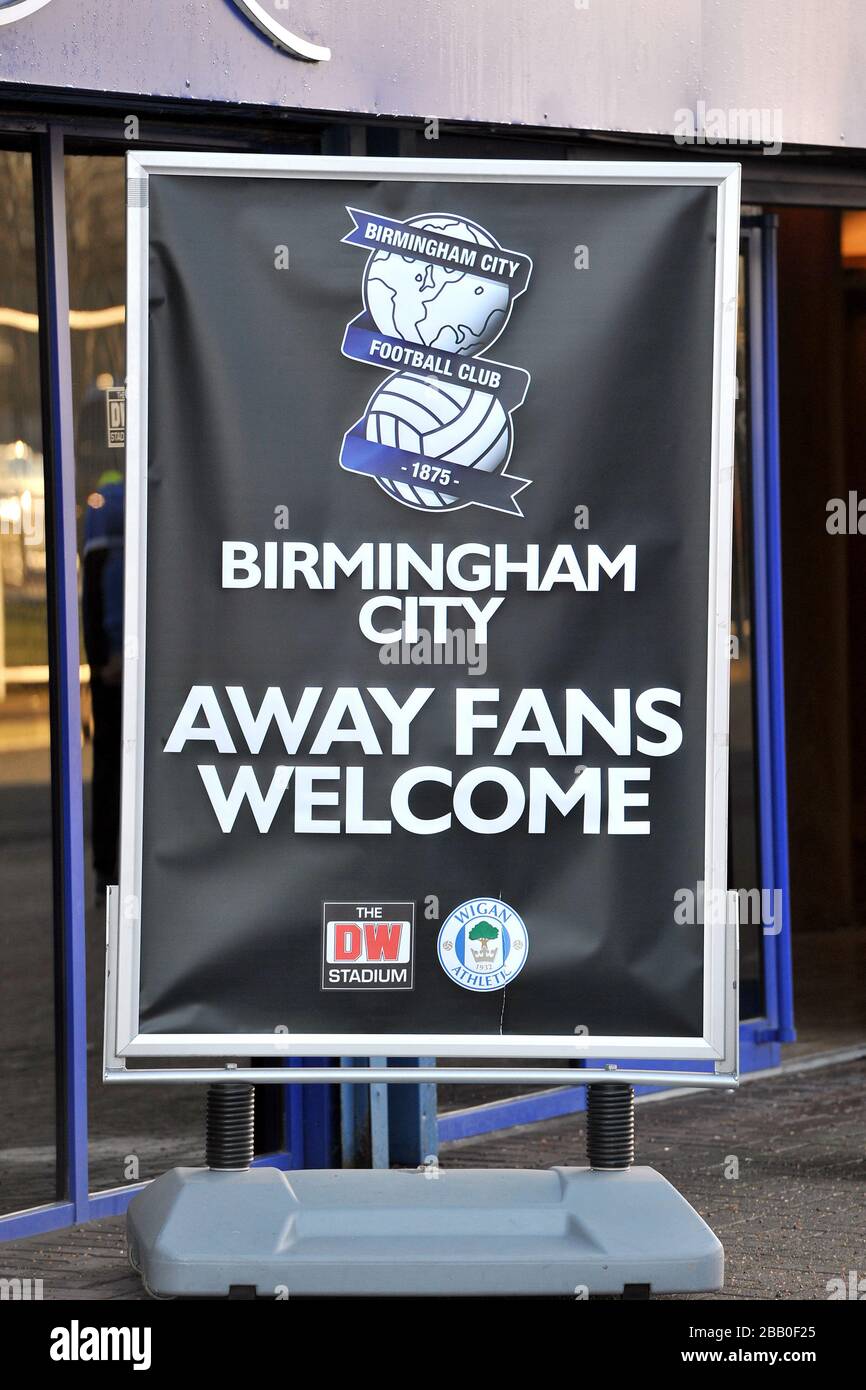 Signage welcoming the away fans at the DW Stadium Stock Photo - Alamy