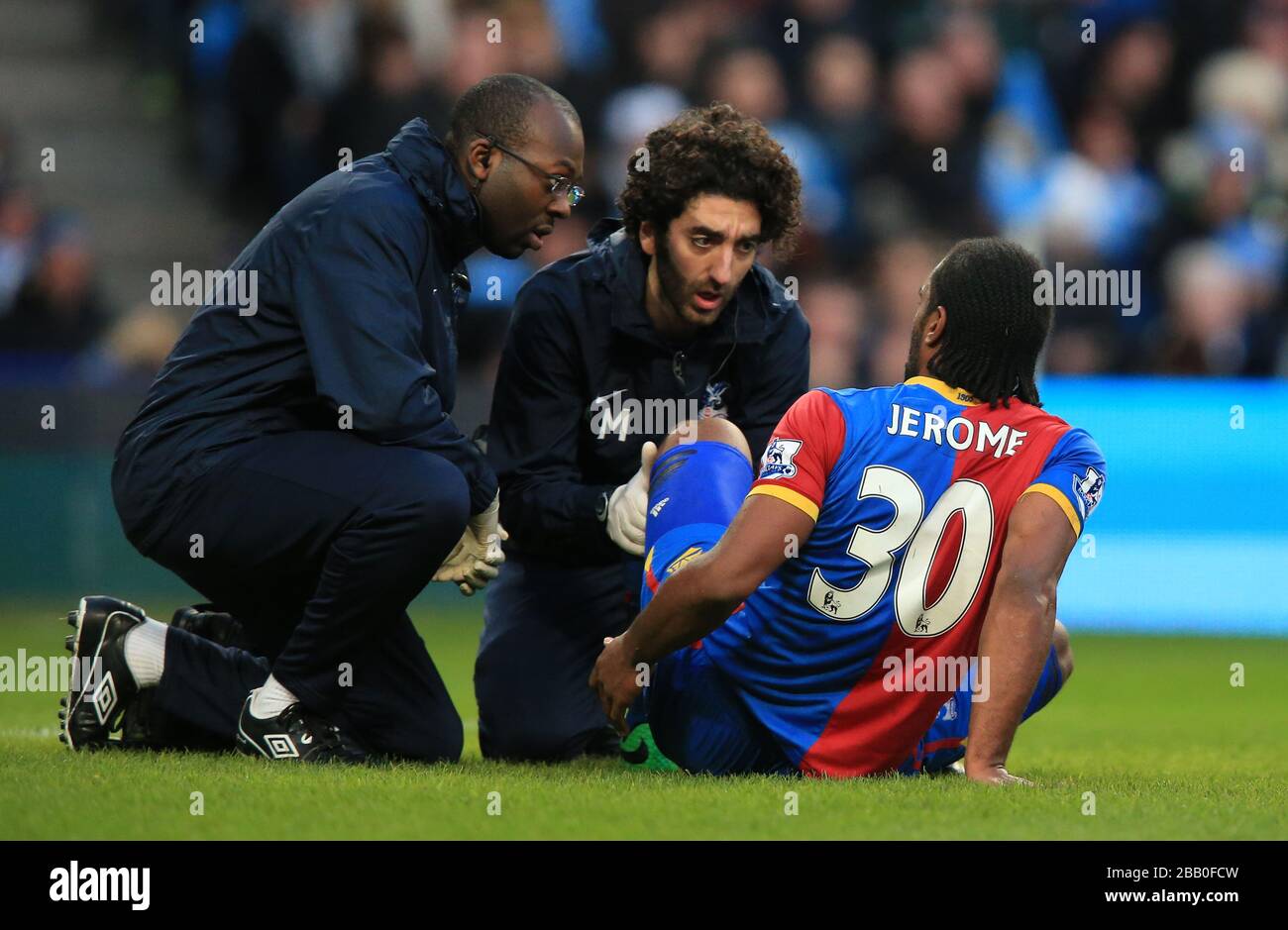 Crystal Palace's Cameron Jerome is treated for an injury before being ...