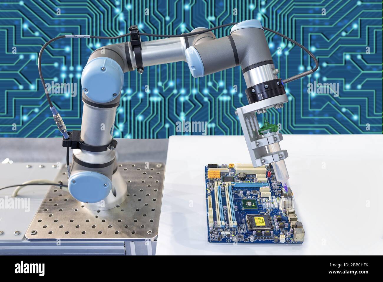 Industrial robot installing a computer chip at production line in ...