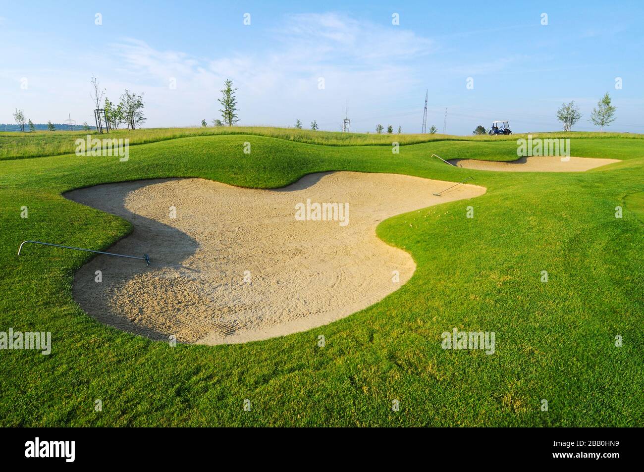 Nice golf course with bunker and nice green Stock Photo - Alamy