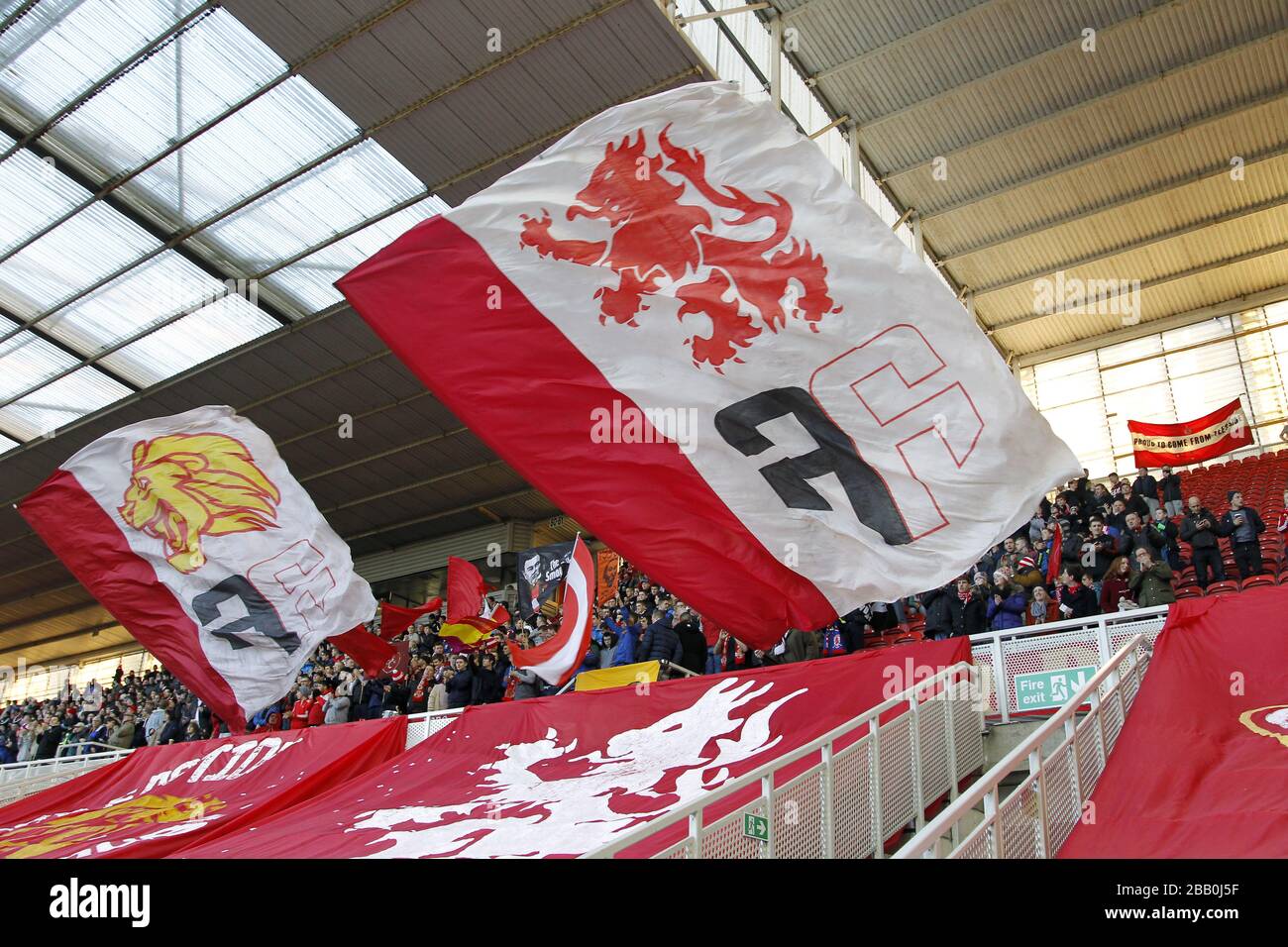 Middlesbrough fans wave flags in the stands Stock Photo - Alamy