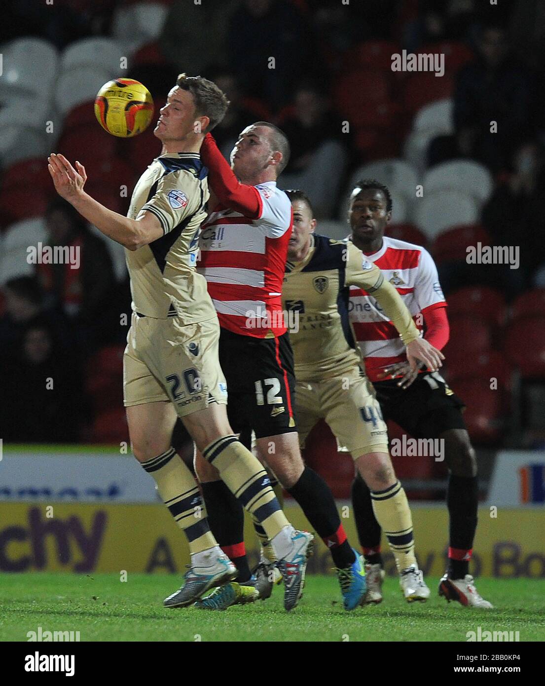 Leeds United's Matt Smith comes under pressure from Doncaster Rovers ...