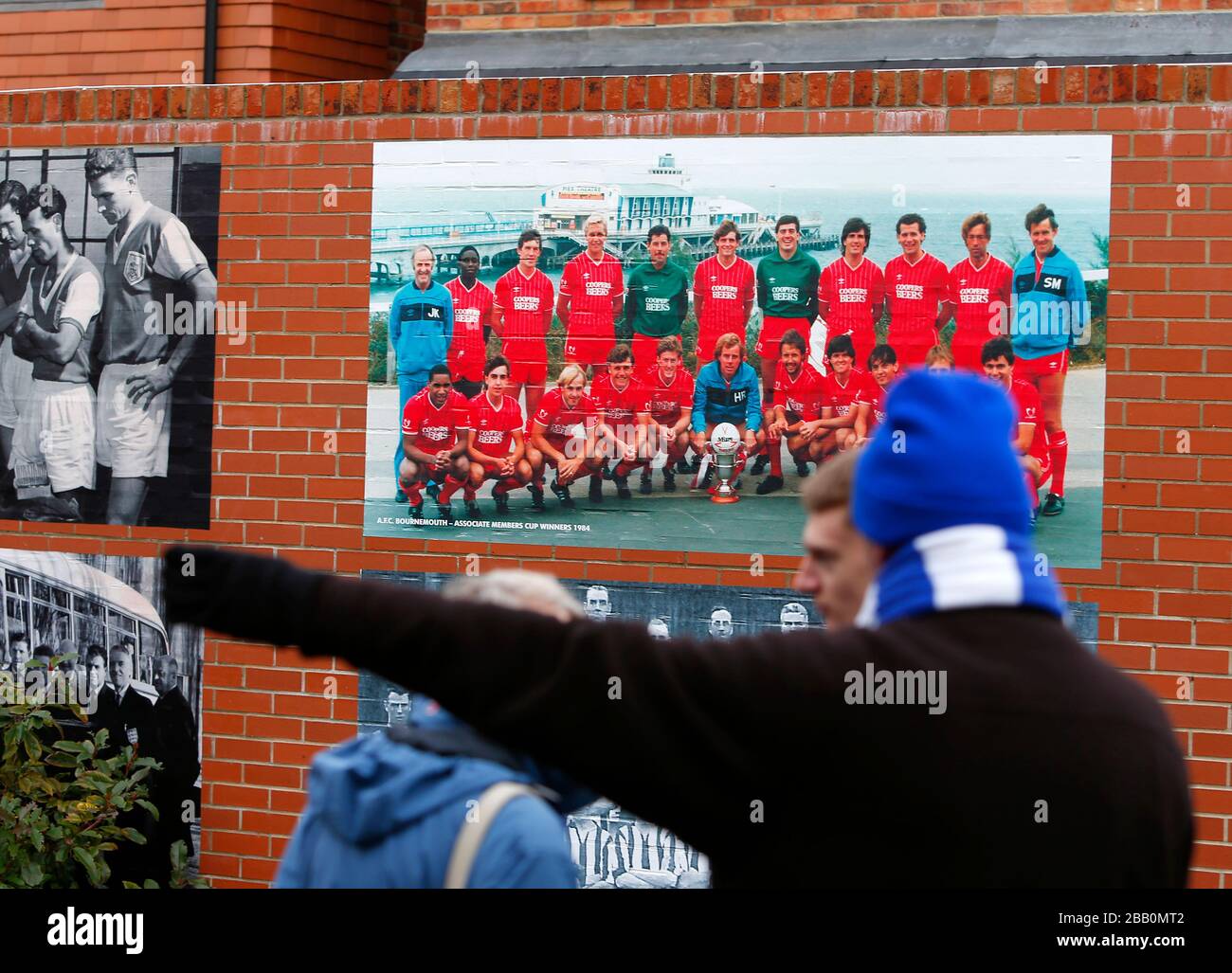 Football fans look at historic AFC Bournemouth pictures on the wall ...
