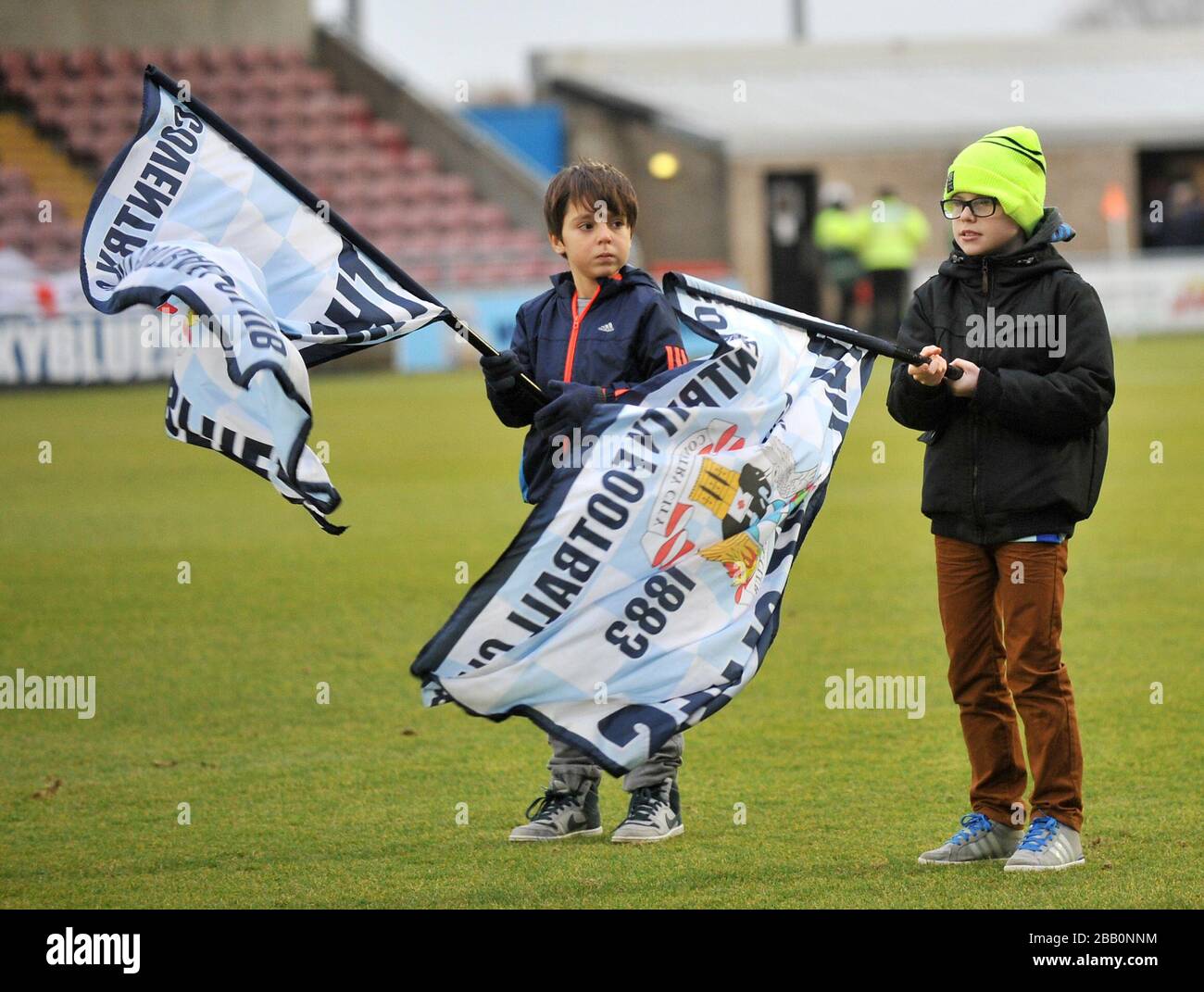 Mascots with flags before kick-off Stock Photo - Alamy
