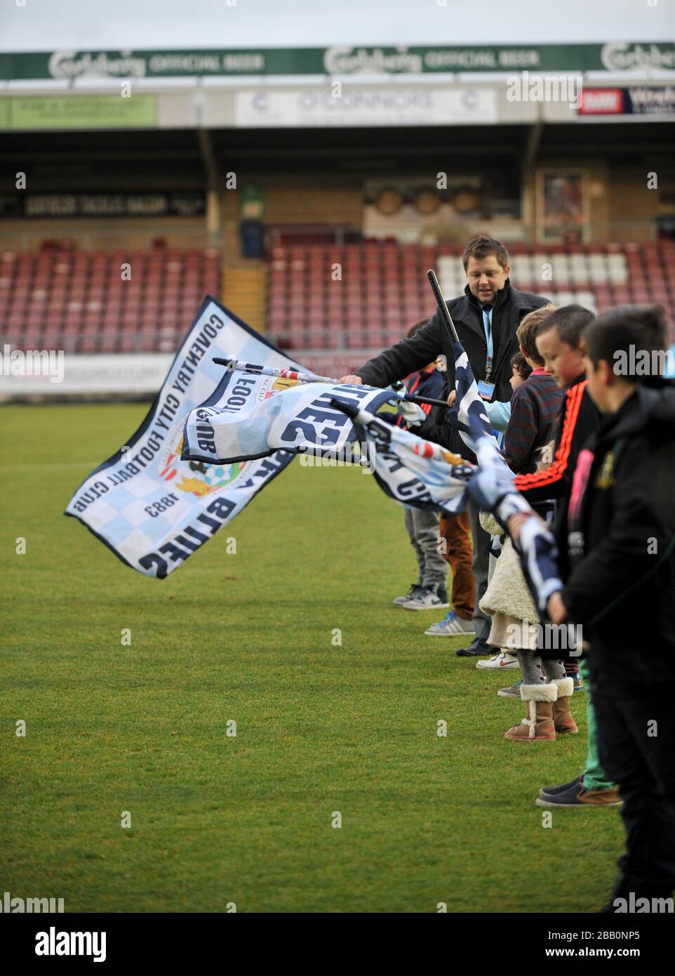 Mascots with flags before kick-off Stock Photo - Alamy