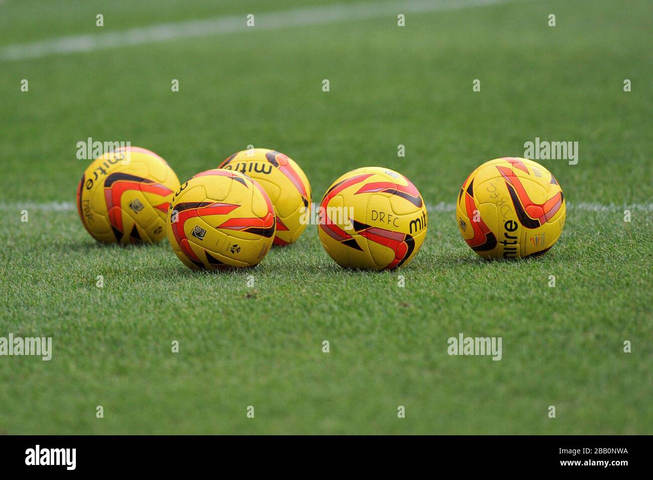 Mitre Footballs on the pitch Stock Photo - Alamy
