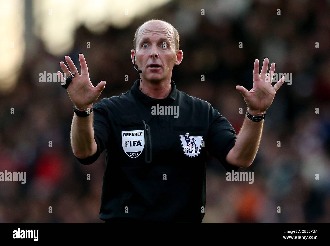 Referee Mike Dean gestures Stock Photo - Alamy