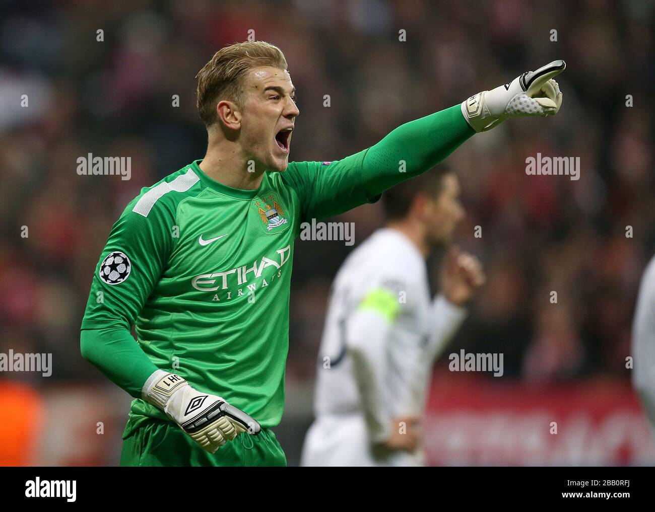 Manchester City goalkeeper Joe Hart shouts instructions at his team ...