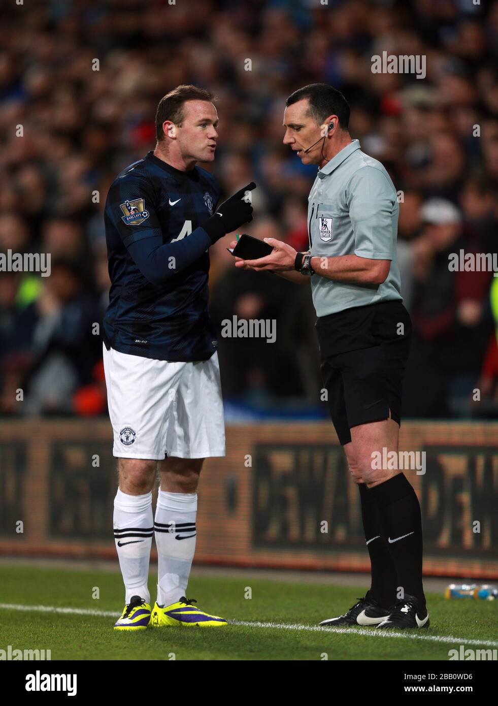 Manchester United's Wayne Rooney and referee Neil Swarbrick Stock Photo ...