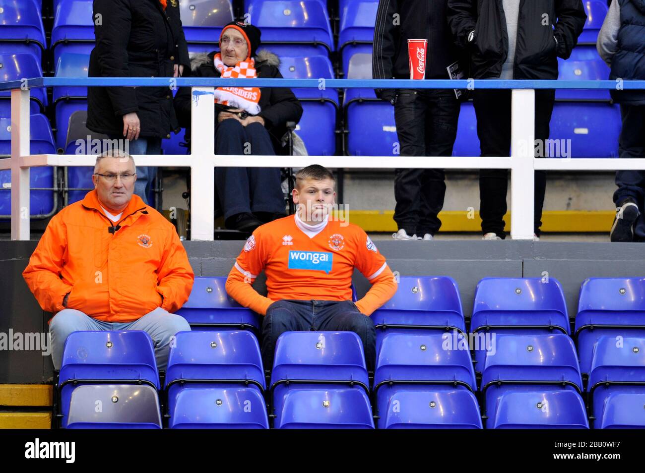 Blackpool fans sit in their seats as they wait for the game to start ...