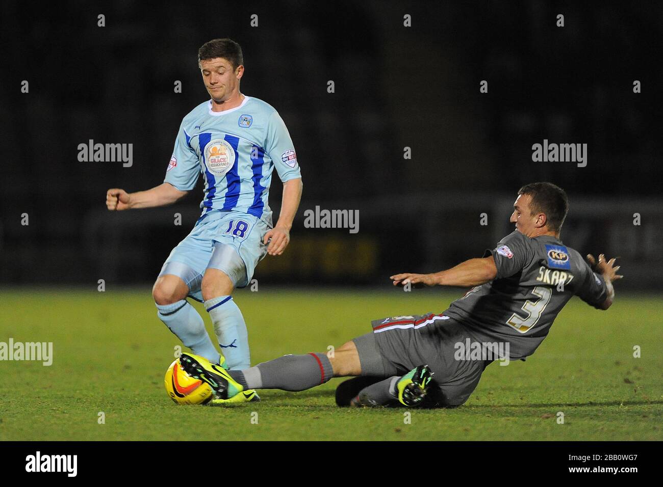 Coventry City's Aaron Phillips is tackled by Rotherham United's Joe ...