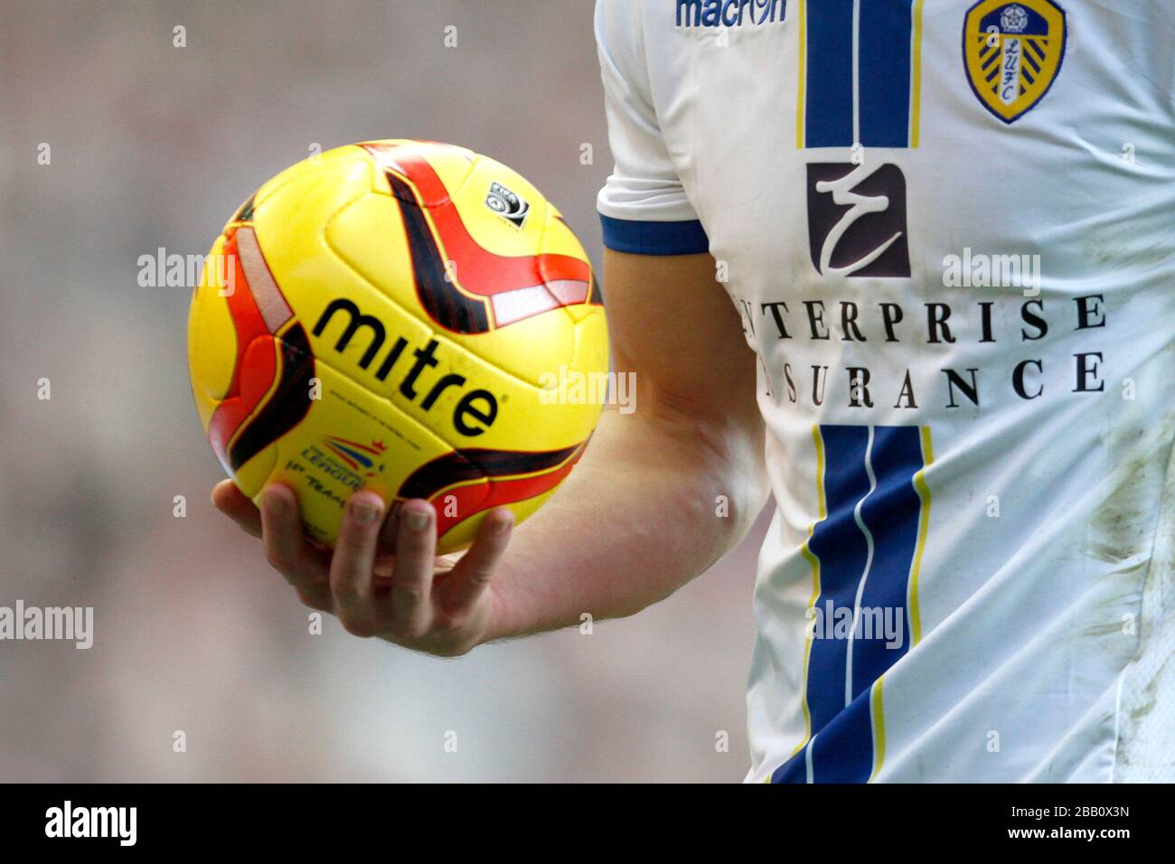 Leeds United player holding an official winter Mitre match ball Stock ...