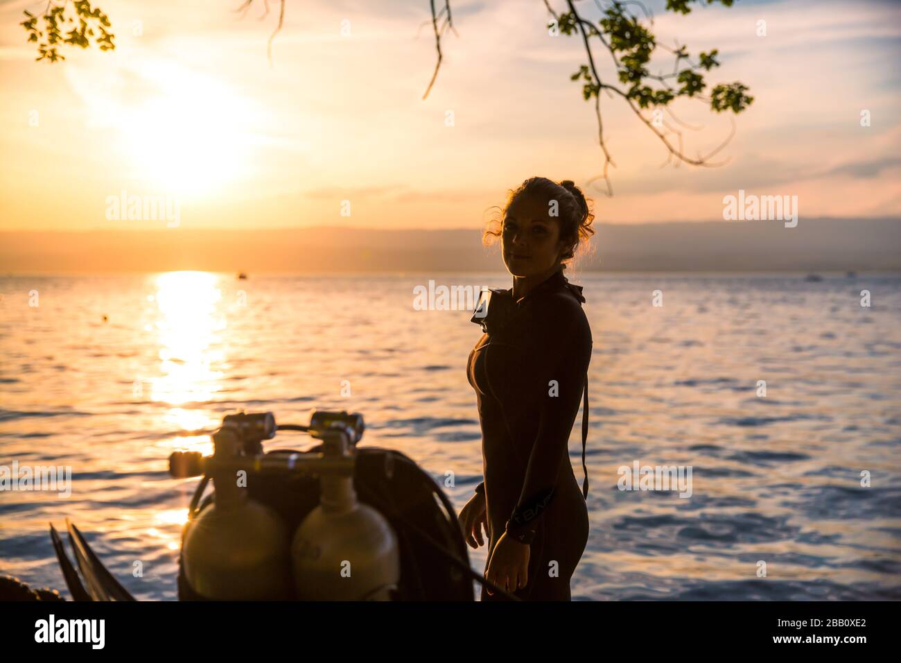 Female Scuba Diving Instructor Wearing a Wet Suit Standing Next to a ...