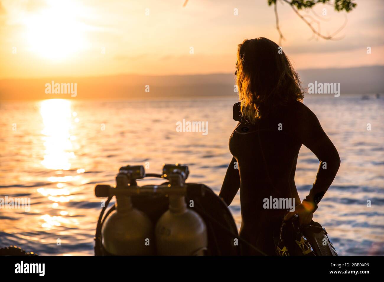 Female Scuba Diving Instructor Wearing a Wet Suit Standing Next to a ...