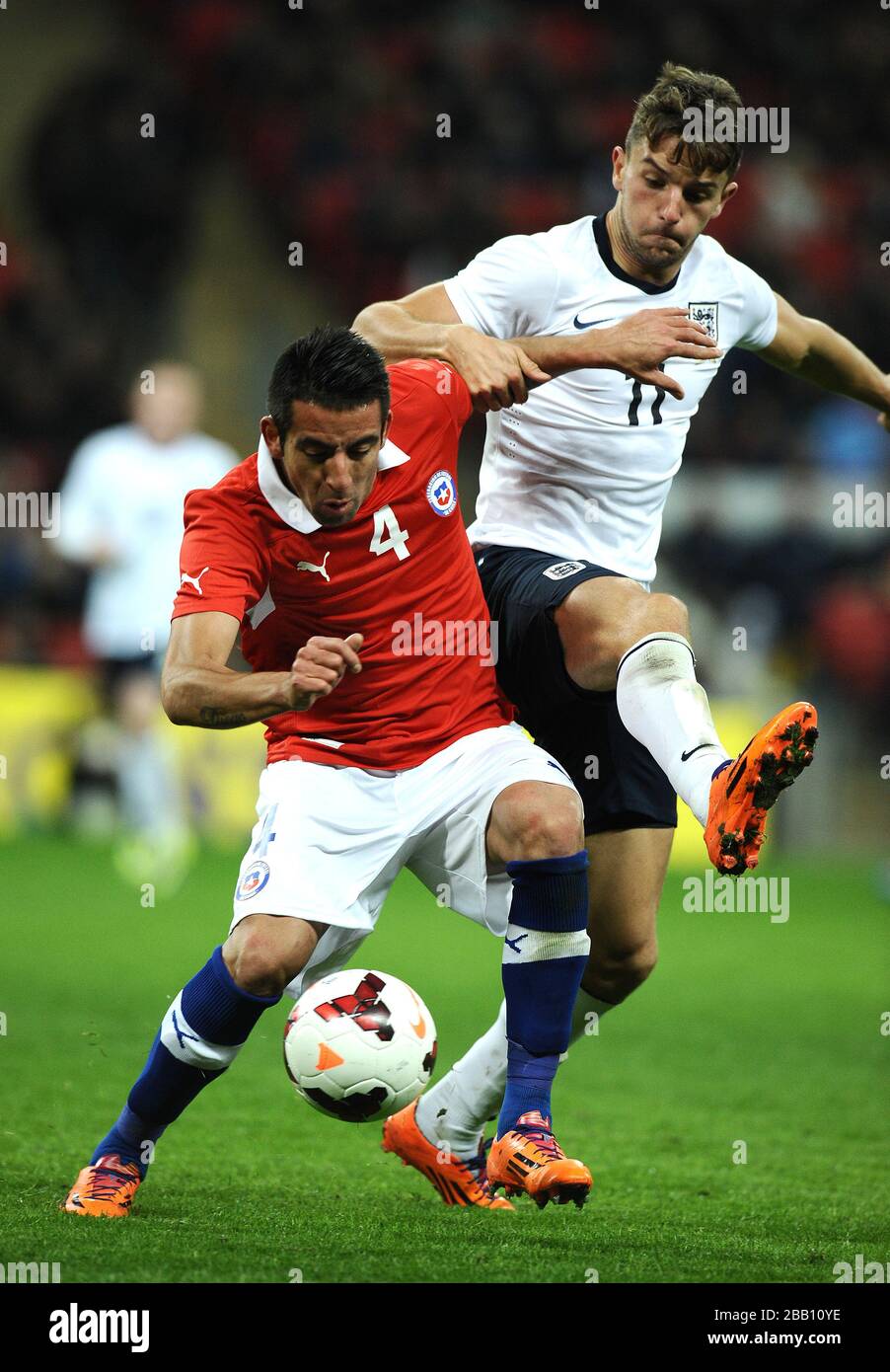 England's Jay Rodriguez challenges Chile's Mauricio Isla Stock Photo ...