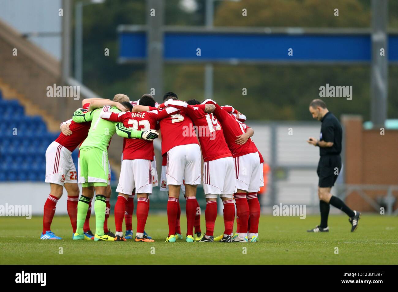 Swindon Town players in a huddle Stock Photo - Alamy