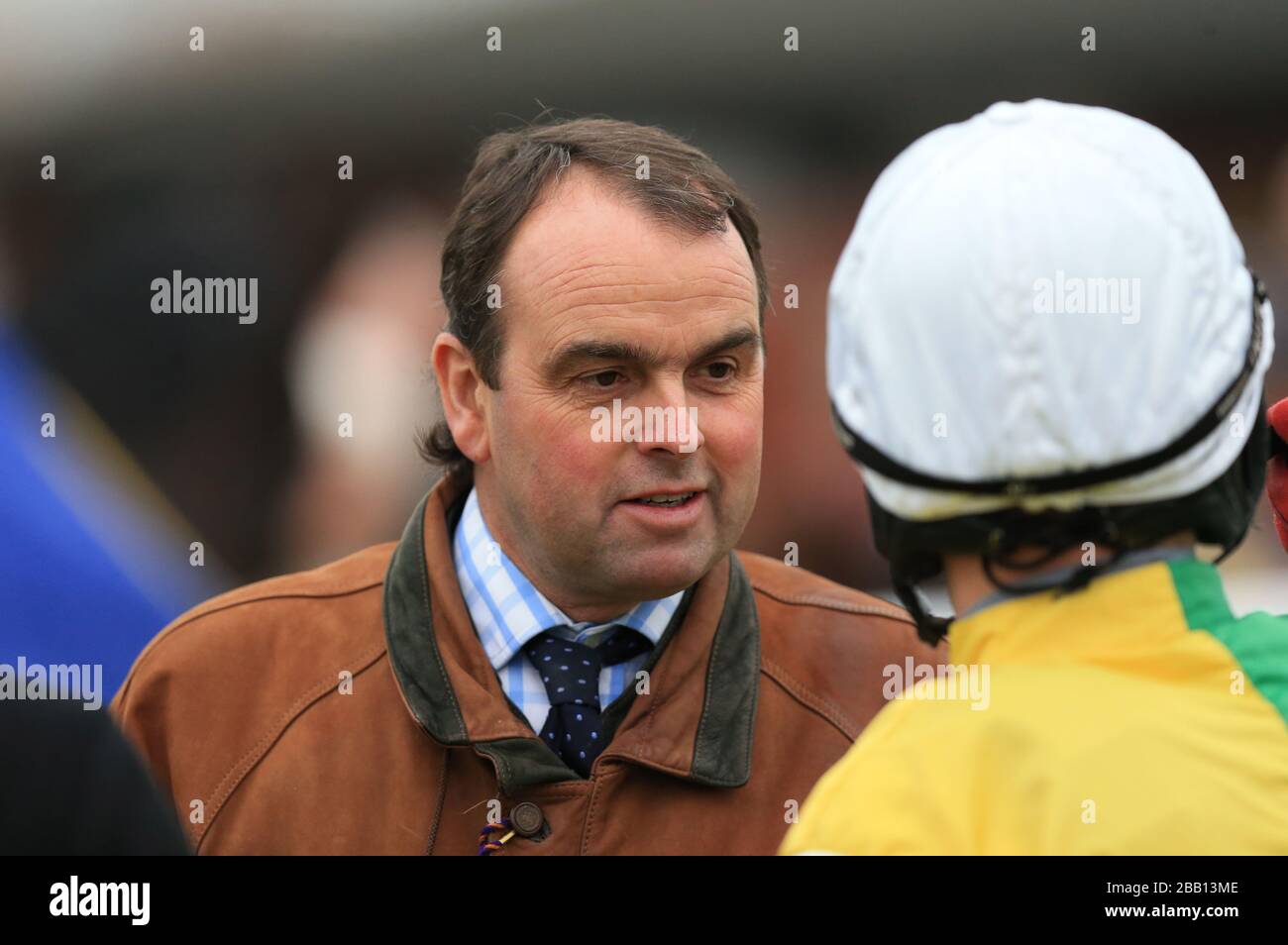 Trainer Alan King speaks with jockey Robert Thornton Stock Photo - Alamy