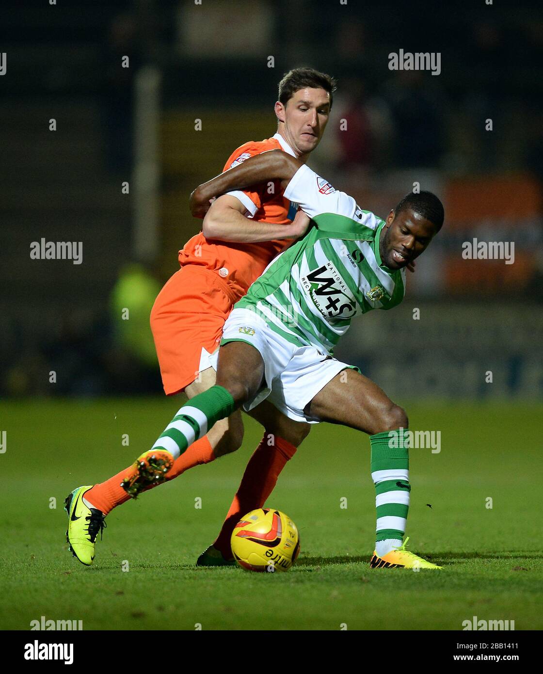 Blackpool's Chris Basham (left) and Yeovil Town's Joel Grant battle for ...