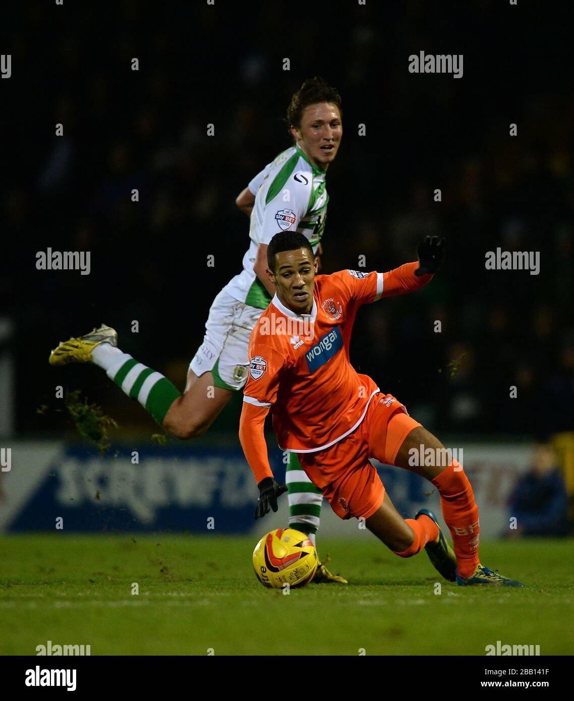 Yeovil Town's Luke Ayling (left) brings down Blackpool's Thomas Ince ...