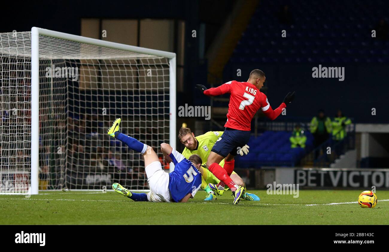 Ipswich Town's goalkeeper Dean Gerken saves at the feet of Blackburn ...