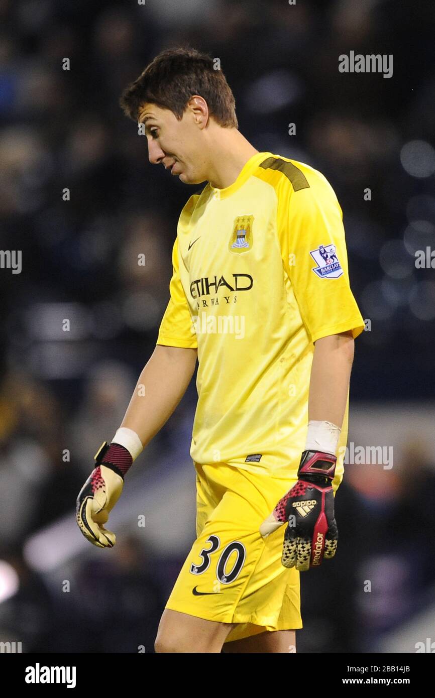 Manchester City goalkeeper Costel Pantilimon reacts after scoring an ...