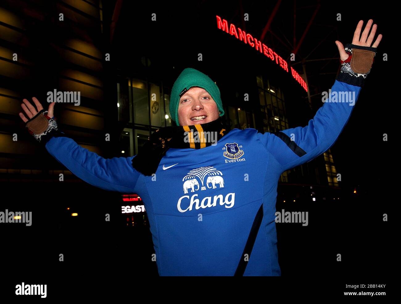 An Everton fans stands outside Old Trafford before the game Stock Photo ...
