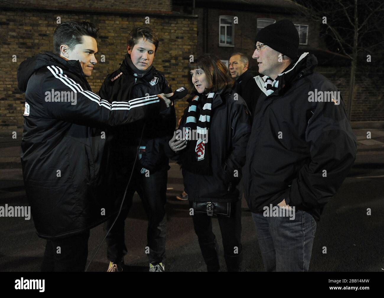 Fulham TV interview fans Stock Photo - Alamy