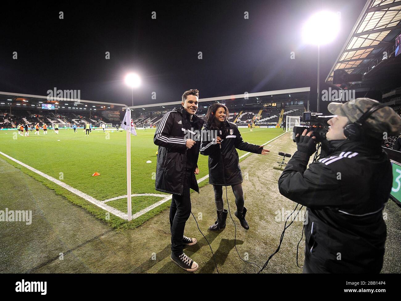 Fulham TV interview fans Stock Photo - Alamy