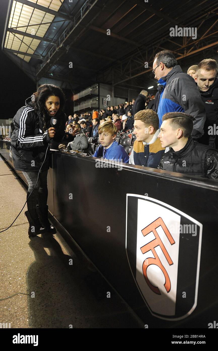 Fulham TV interview fans Stock Photo - Alamy