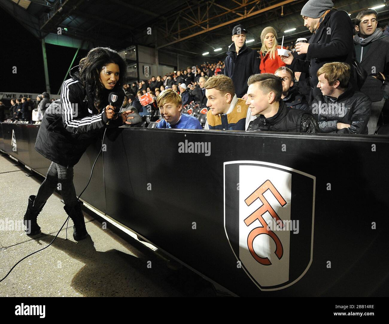 Fulham TV interview fans Stock Photo - Alamy